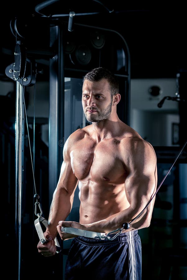 Man doing cable fly in gym stock image. Image of caucasian - 50173339