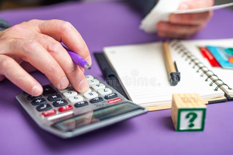 Man Doing Calculations on a Calculator To File a Tax Return Stock Photo ...