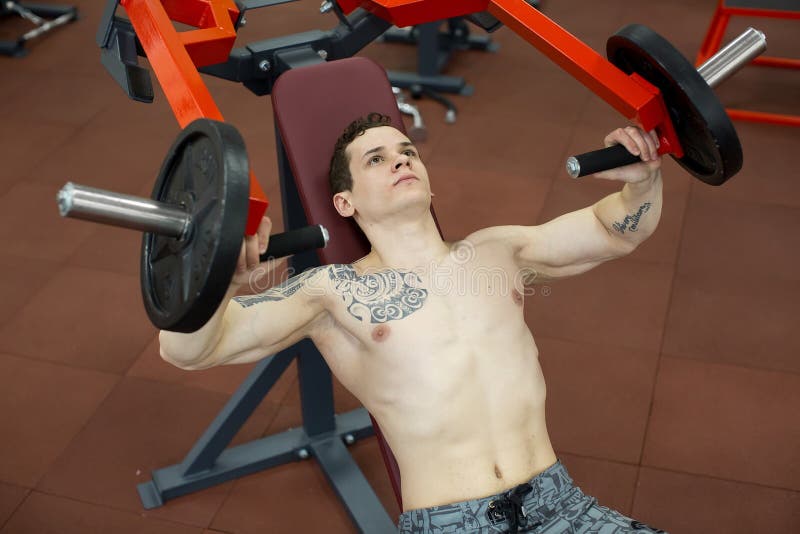 Man Doing Chest Exercises on Vertical Bench Press Machine. Stock Image ...