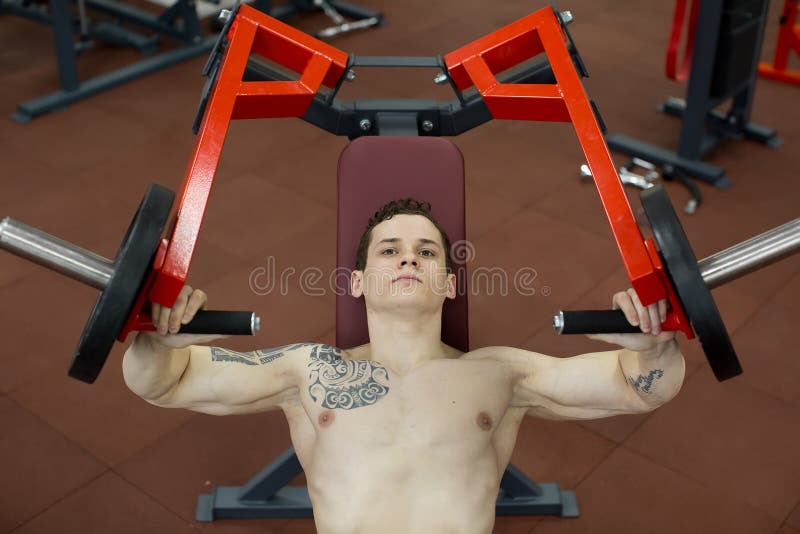 Man Doing Chest Exercises on Vertical Bench Press Machine. Stock Image ...