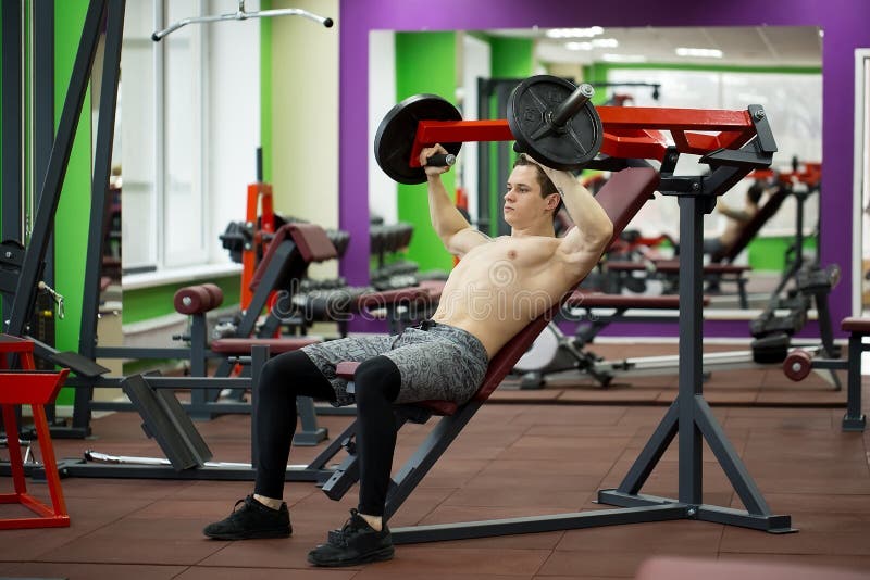 Man Doing Chest Exercises on Vertical Bench Press Machine. Stock Photo ...