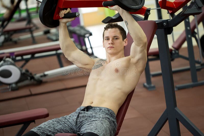 Man Doing Chest Exercises on Vertical Bench Press Machine. Stock Image ...