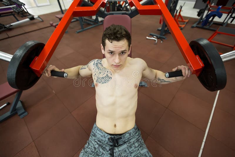 Man Doing Chest Exercises on Vertical Bench Press Machine. Stock Photo ...