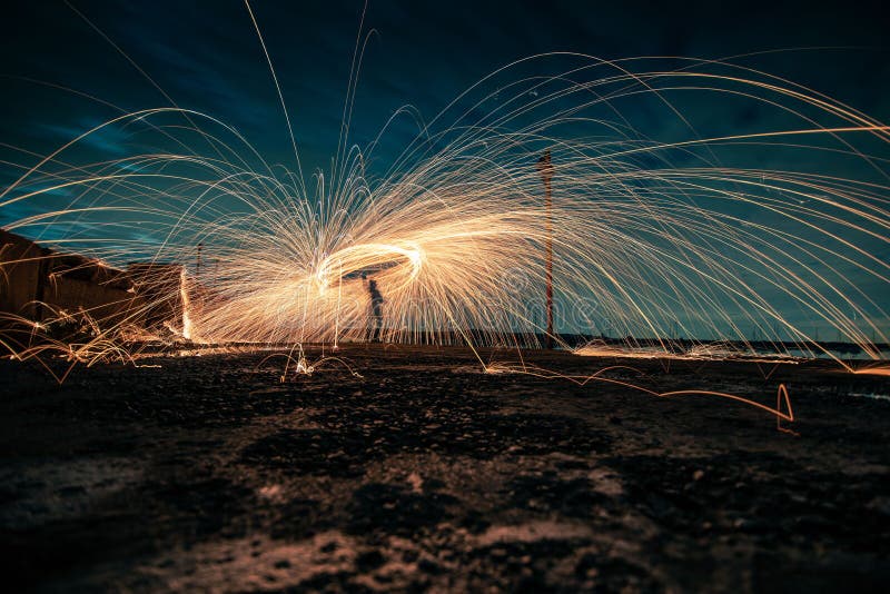 Man Doing a Circular Spinning Light Using Steel Wool at Night Stock ...