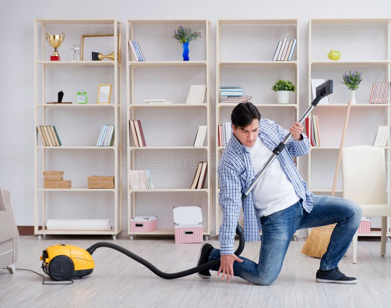 Man doing cleaning at home stock image. Image of dusting - 160875749