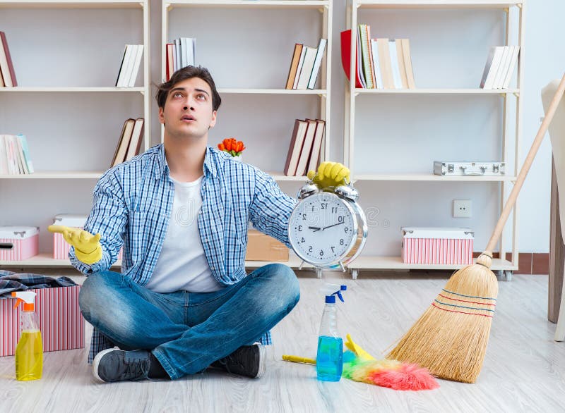 Man doing cleaning at home stock photo. Image of home - 164913924