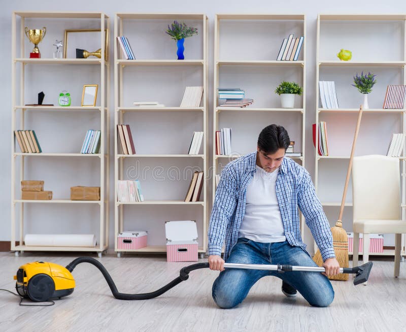 Man doing cleaning at home stock photo. Image of chores - 195129478