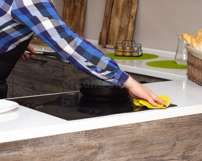 A Man Doing the Cleaning in the Modern Kitchen, Close-up, Hand and Rag ...