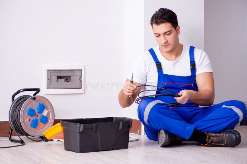 The Man Doing Electrical Repairs at Home Stock Photo - Image of builder ...