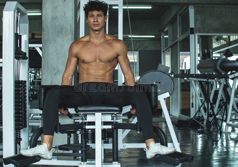 A Man is Doing Exercise in Gym Stock Photo - Image of equipment ...