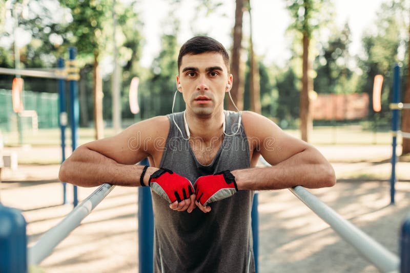 Man Doing Exercise on Parallel Bars, Front View Stock Image - Image of ...