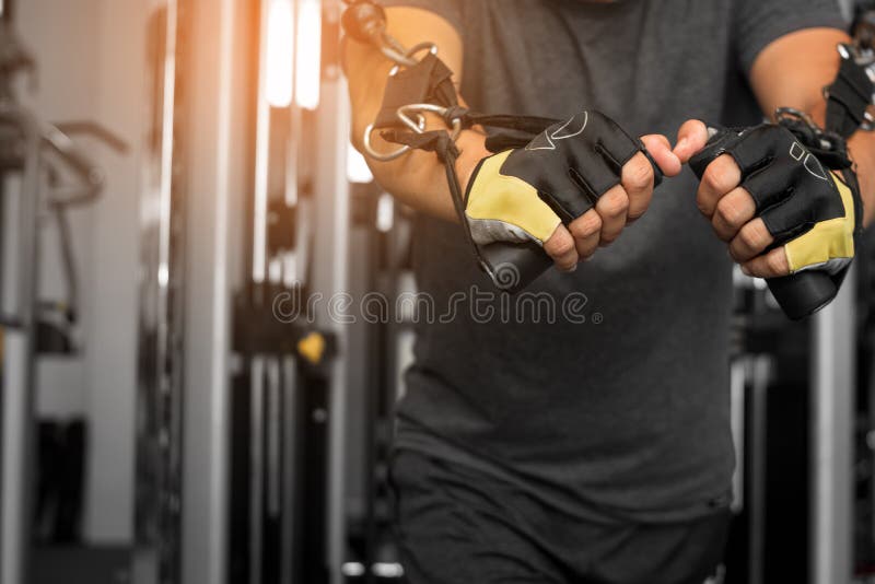 Man Doing Exercise Workout Machine at Fitness Gym Stock Photo - Image ...