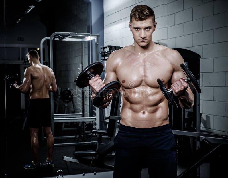 Man Doing Exercises with Dumbbells in the Gym S Studio Stock Image ...