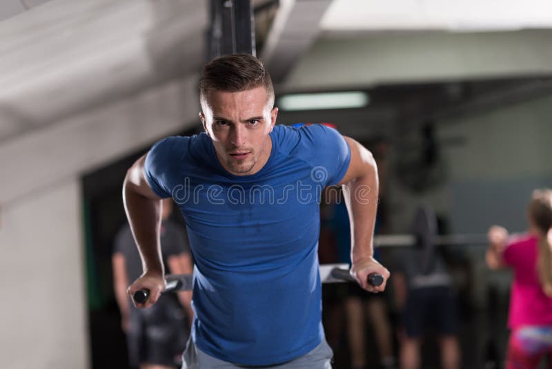 Man Doing Exercises Parallel Bars Stock Photo - Image of fitness ...