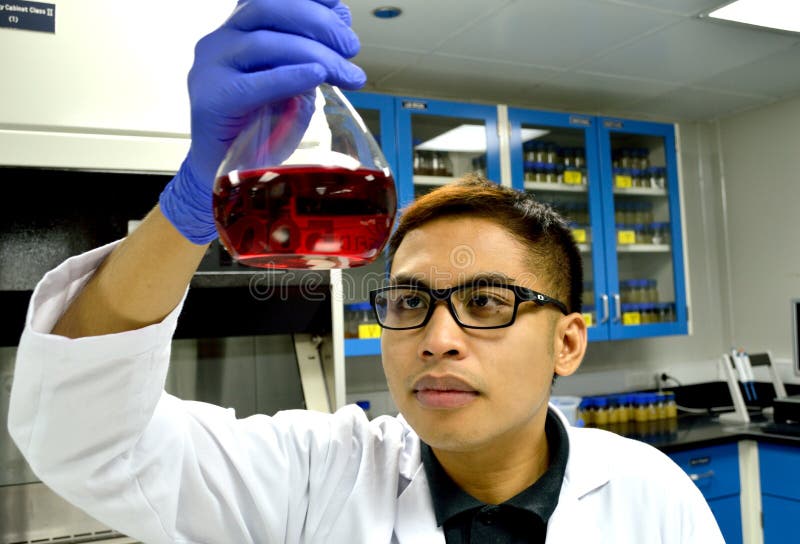 Man Doing an Experiment Holding a Flask Stock Photo - Image of reagent ...