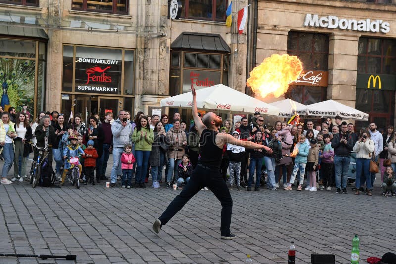Man Doing Fire Tricks during a Fire Show in the Street in Front of a ...