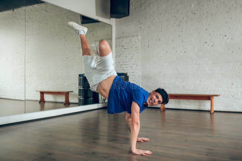 Man Doing a Handstand on the Floor while Dancing Stock Image - Image of ...