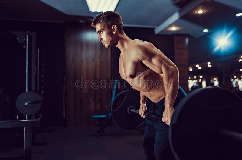 Man Doing Heavy Weight Exercise for Back. Pain and Gain Stock Image ...