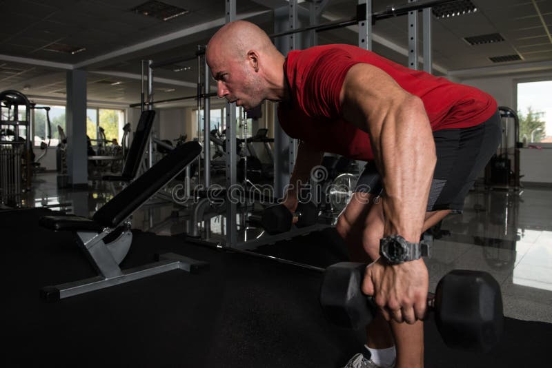 Man Doing Heavy Weight Exercise for Back Stock Photo - Image of muscles ...