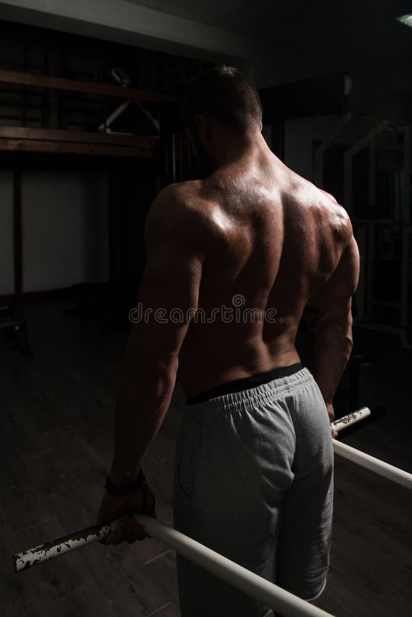 Man Doing Heavy Weight Exercise for Trapezius Stock Image - Image of ...