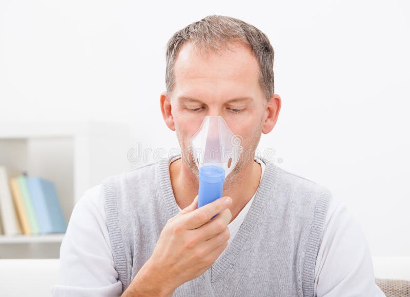 Man doing inhalation stock photo. Image of inhaler, male - 40194808
