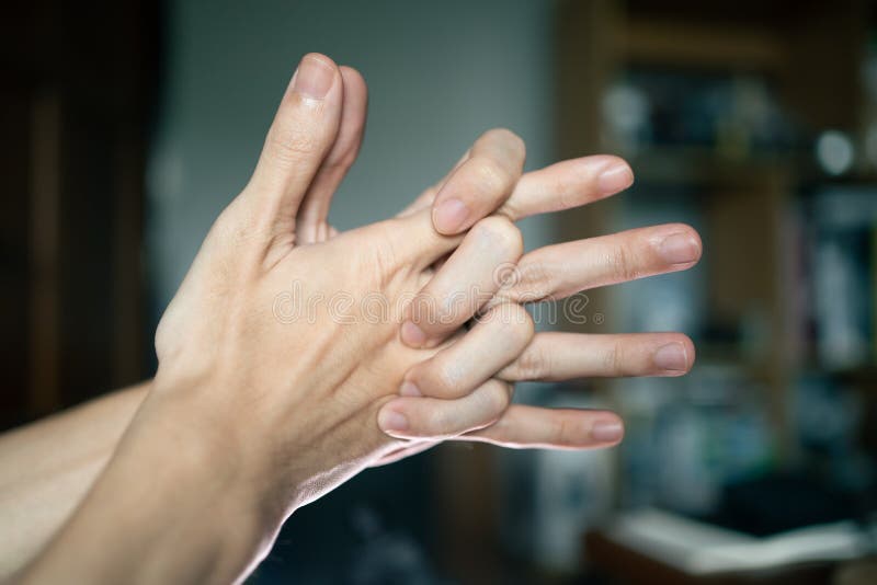 A Man Doing a Knuckle Cracking Stock Photo - Image of knuckle, finger ...