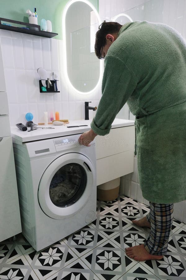 Man Doing Laundry Bathroom Loading Washer Stock Photos - Free & Royalty-Free Stock Photos from ...