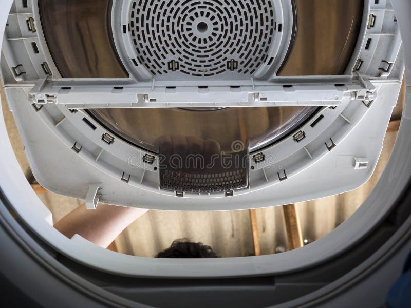 Man Doing Laundry from Inside of Washing Machine Stock Image - Image of ...
