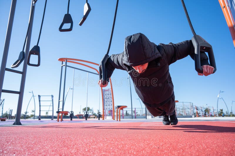 Man Doing Loop Exercises Outdoors. Stock Photo - Image of motivation ...