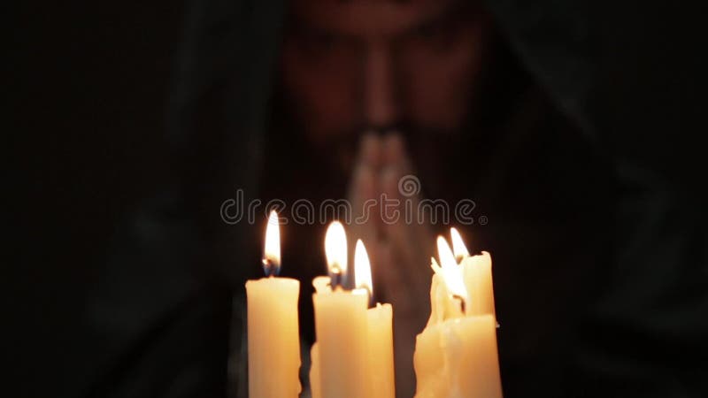 Man Doing the Magic Ritual. Close-up Several Candle and Old Book Stock ...