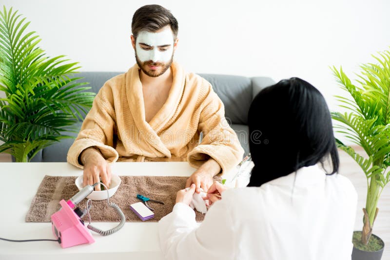 Man doing manicure stock photo. Image of massaging, face - 95209744