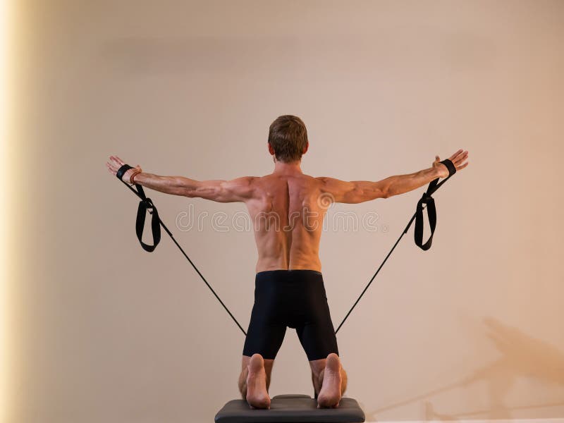 A Man Doing Pilates on a Reformer. Stock Photo - Image of pilates ...