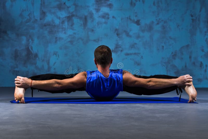 Man Doing the Pose of Yoga Lying on His Back Stock Photo - Image of ...