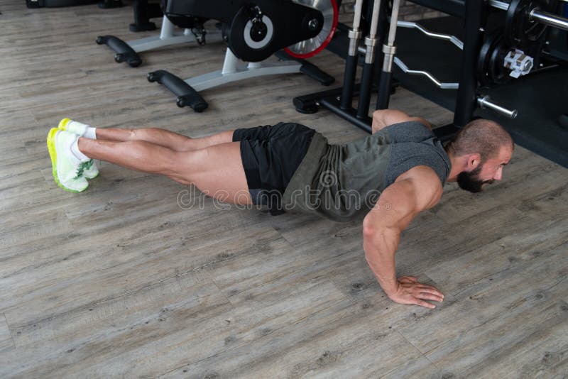 Man Doing Press Ups in Gym stock photo. Image of healthy - 183032270