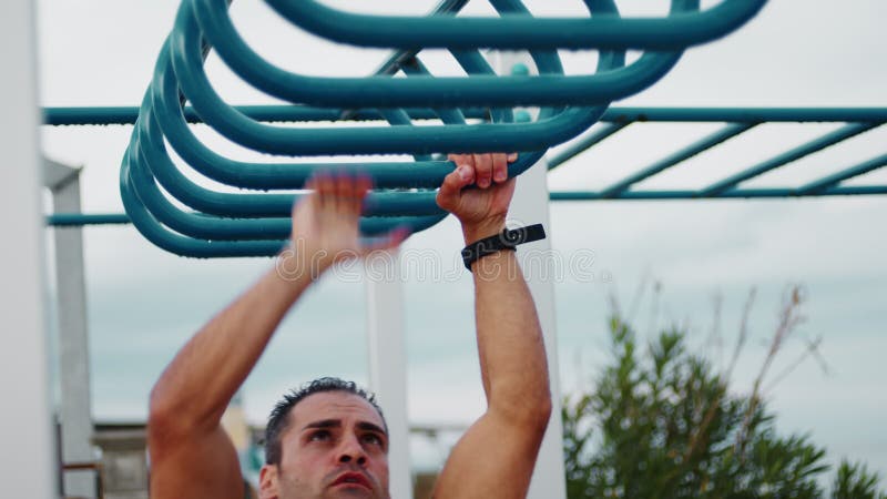 Man Doing Pull Ups Across Monkey Bar Stock Footage - Video of ...