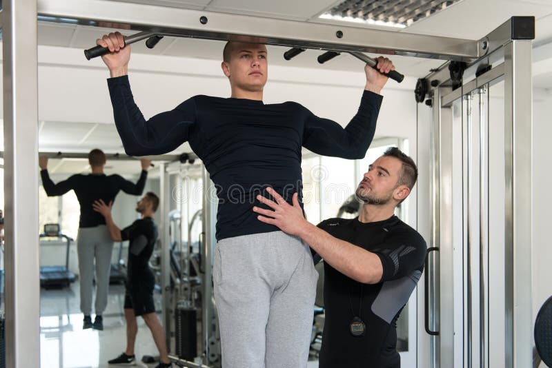 Man Doing Pull Ups Exercises Gym Coach Stock Photos - Free & Royalty ...