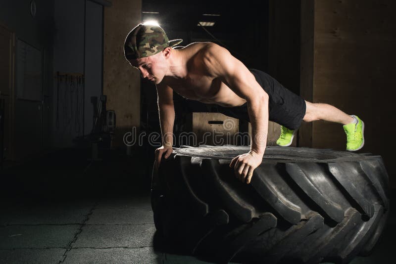 Push Up Exercise on Tire Fitness Training Stock Photo - Image of power ...