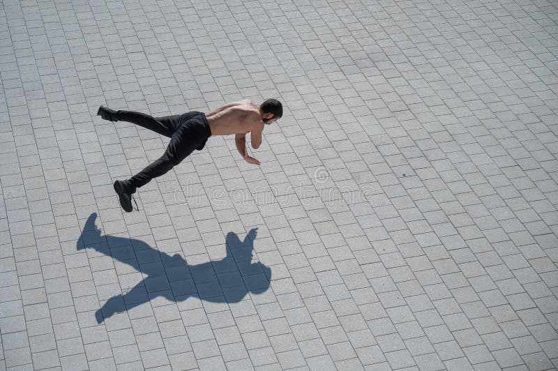 A Man Doing Push-ups with Flying Outdoors. Stock Photo - Image of ...
