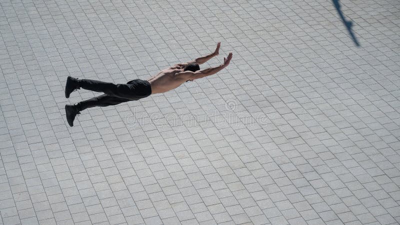 A Man Doing Push-ups with Flying Outdoors. Stock Image - Image of ...