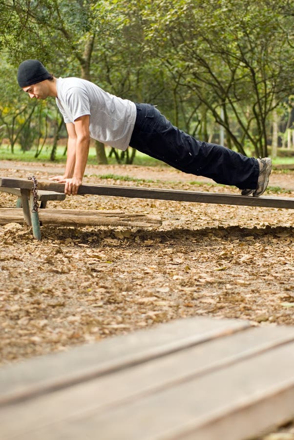 Man Doing Push-ups Outside - Vertical Stock Image - Image of park ...