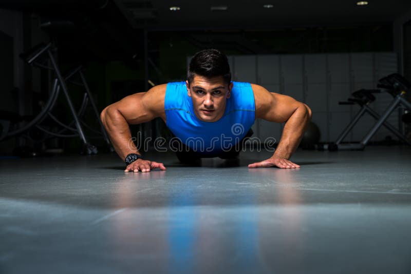 Man Doing Pushups stock photo. Image of blue, muscular - 32780088