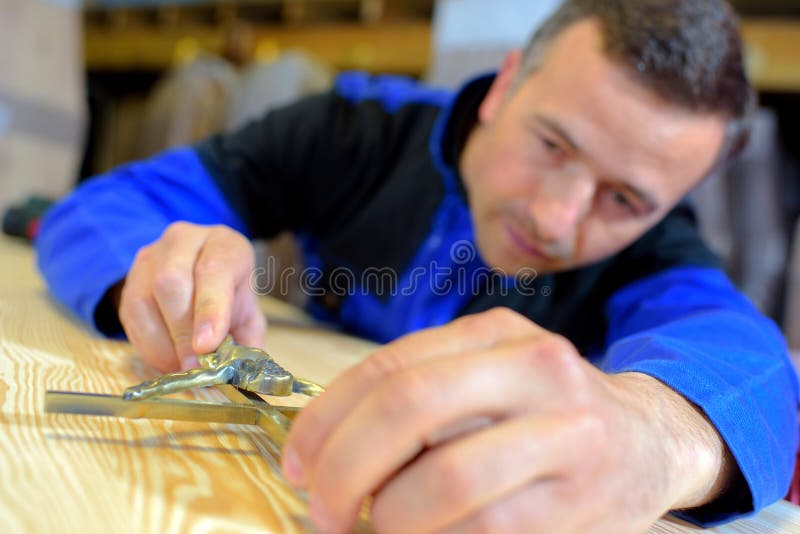 Man doing religious craft stock photo. Image of measure - 300770270