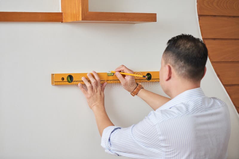 Man Measuring the Wall with Level Stock Image - Image of person ...