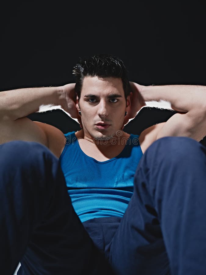 Man Doing Push-ups on Black Background Stock Photo - Image of brunette ...