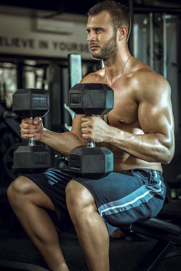 Man doing shoulder press stock image. Image of lifting - 48007261