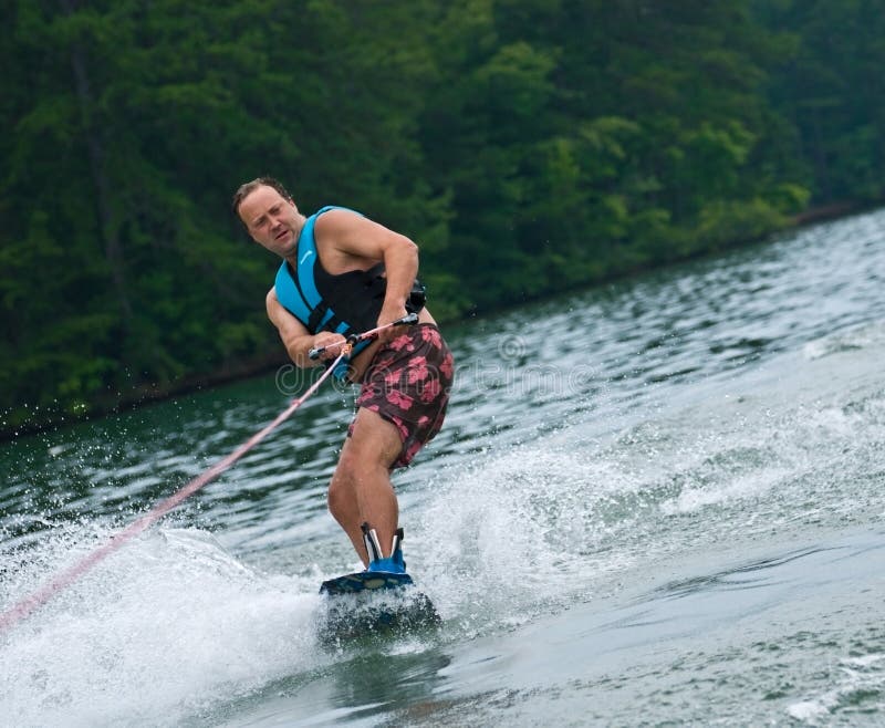 Man Doing a Side Slide/Trick Ski Stock Photo - Image of person, weekend ...