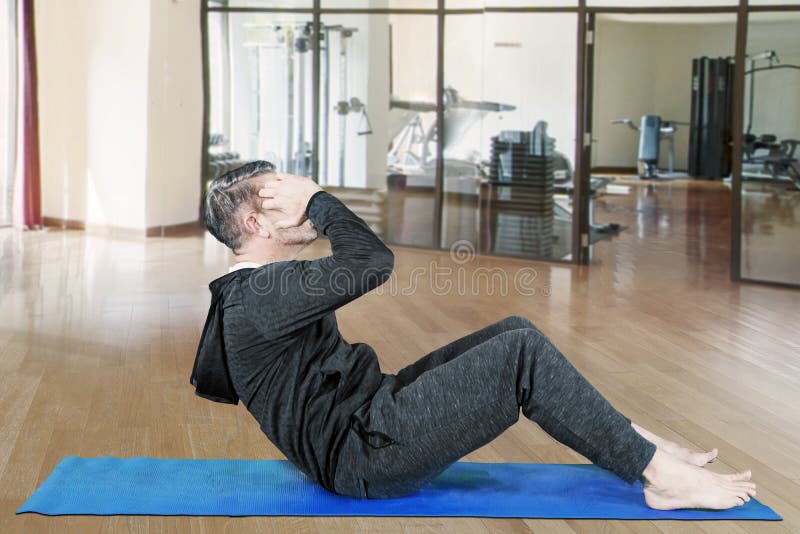 Man Doing Sit-up Exercise at Gym Stock Photo - Image of health ...