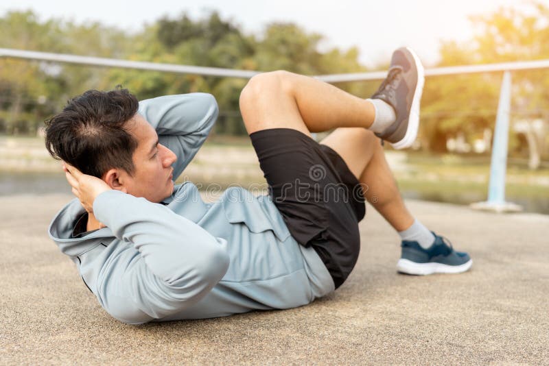 Man Doing Sit Up Exercise Workout Outdoors Stock Photo - Image of ...