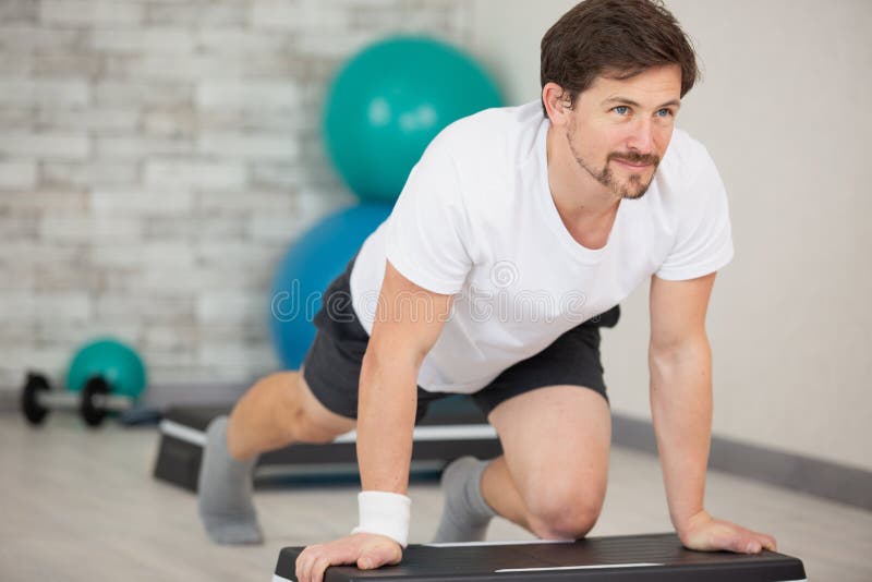 Man Doing Step Up Jumps in Health Club Stock Image - Image of healthy ...