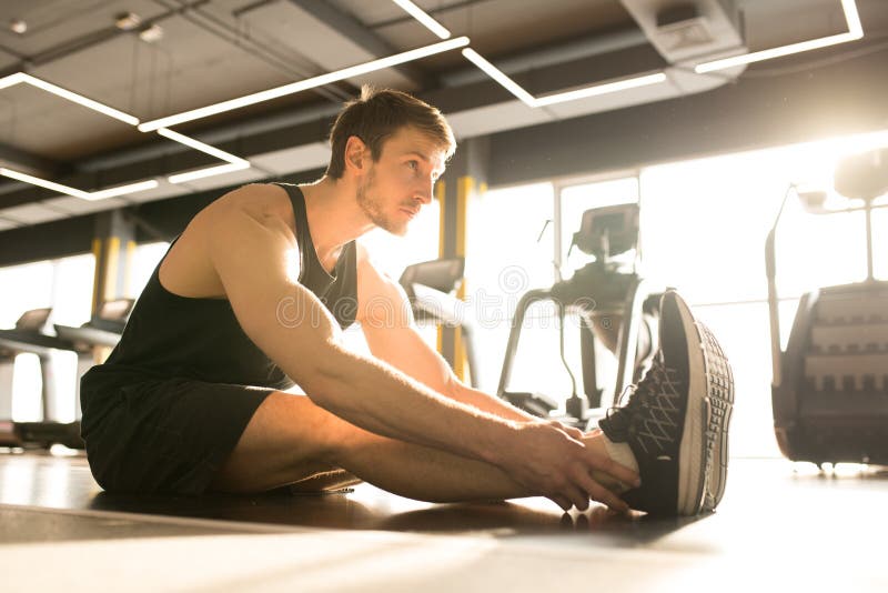 Man Doing Stretching Exercise Stock Image - Image of wellbeing ...